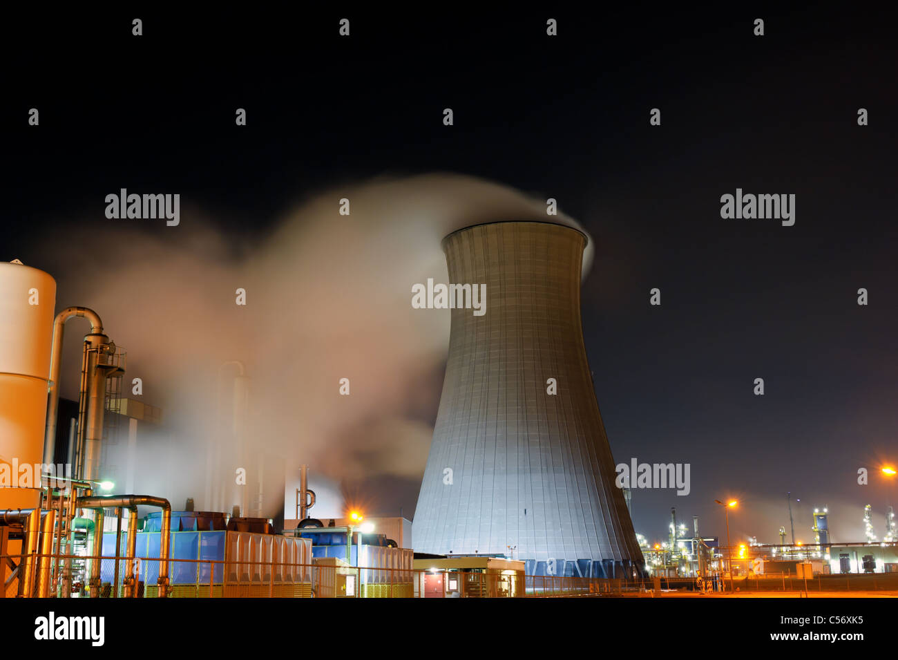 active cooling tower at night Stock Photo - Alamy