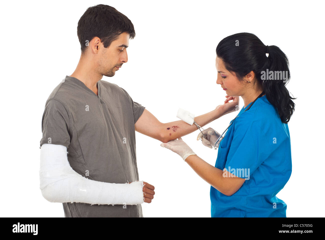 Doctor cleaning wound hand to injured man patient with broken hand ...