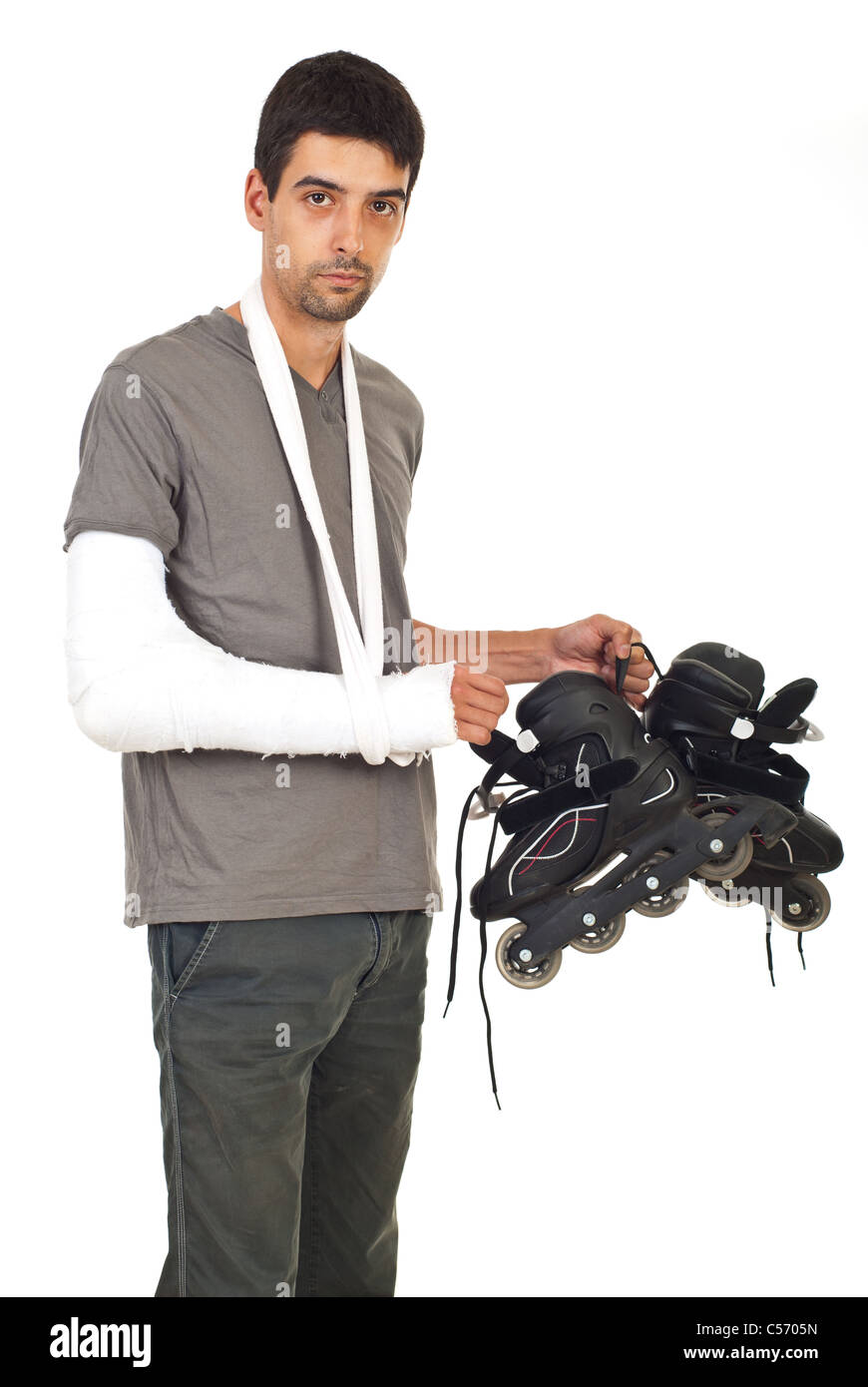 Injured sad man holding rollerskating isolated on white background ...
