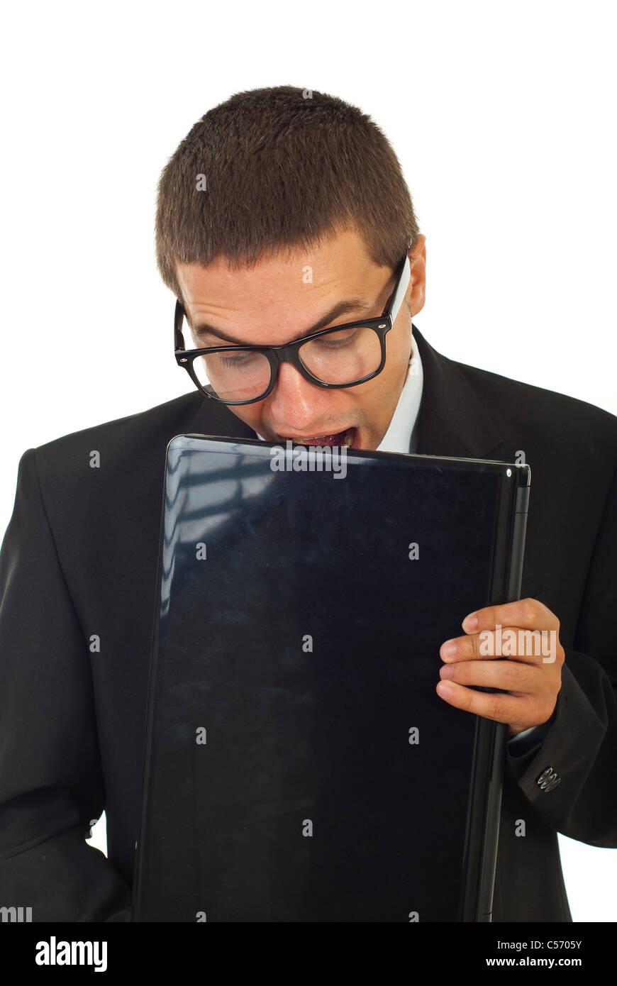 Crazy business man biting laptop isolated on white background Stock ...