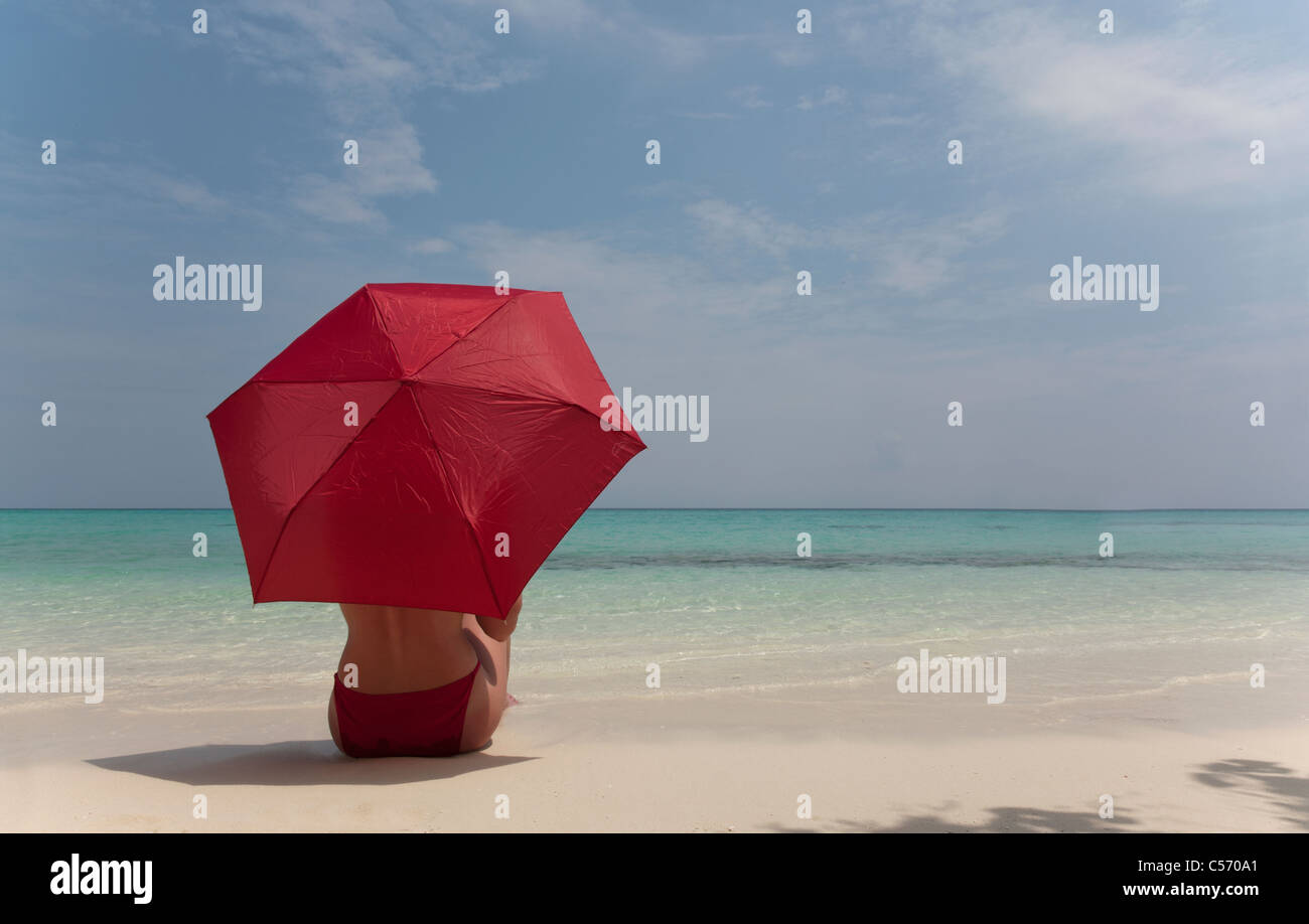 Seated underneath an umbrella hi-res stock photography and images - Alamy