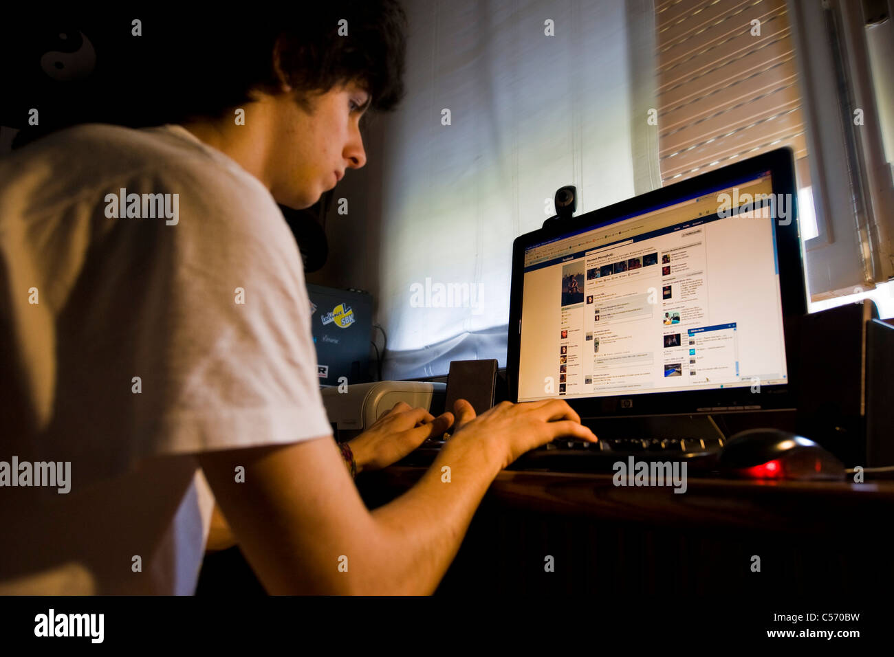 Boy, facebook, computer Stock Photo - Alamy