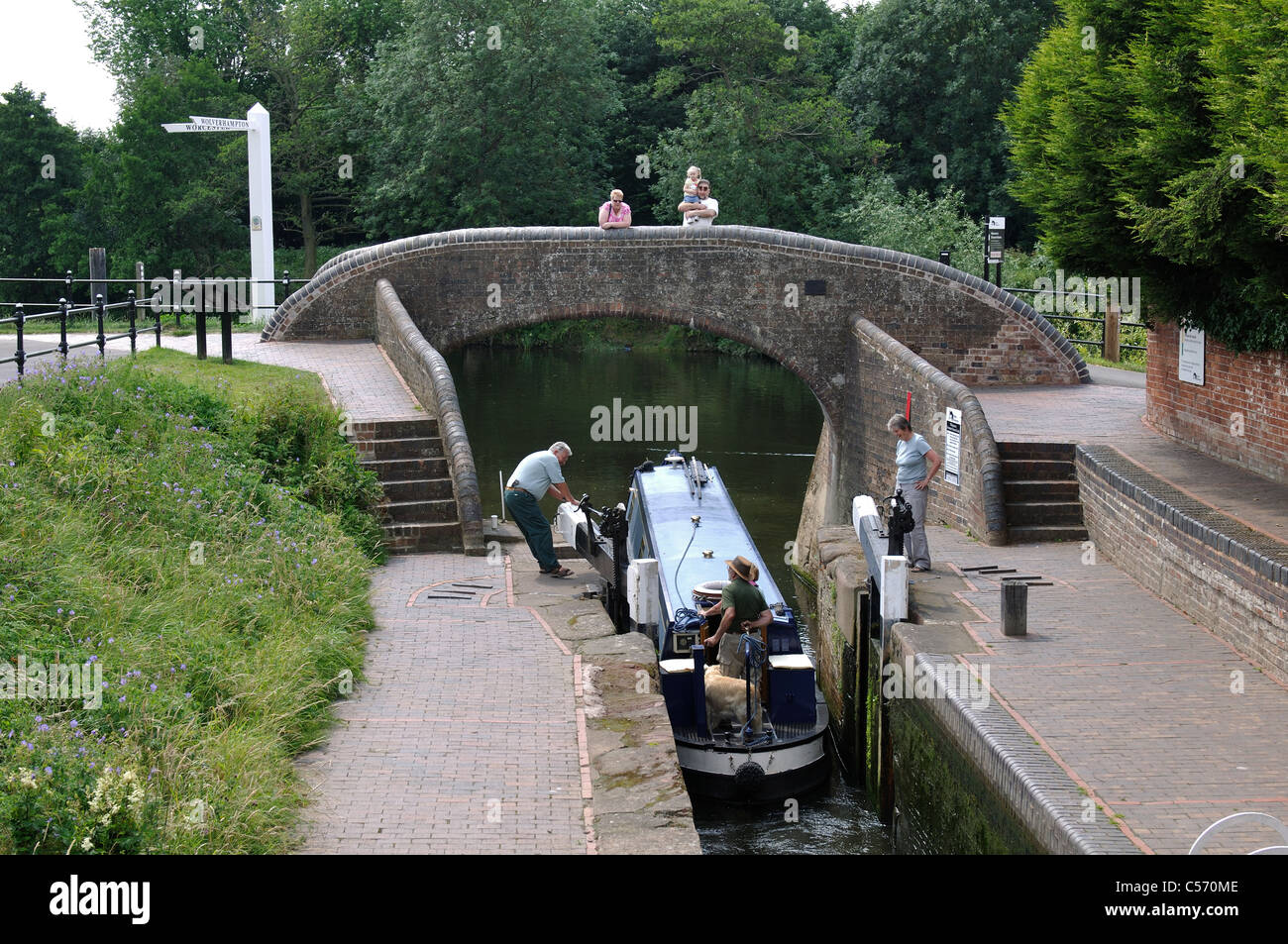 Narrowboat joining the River Severn from a canal lock, Stourport-on ...