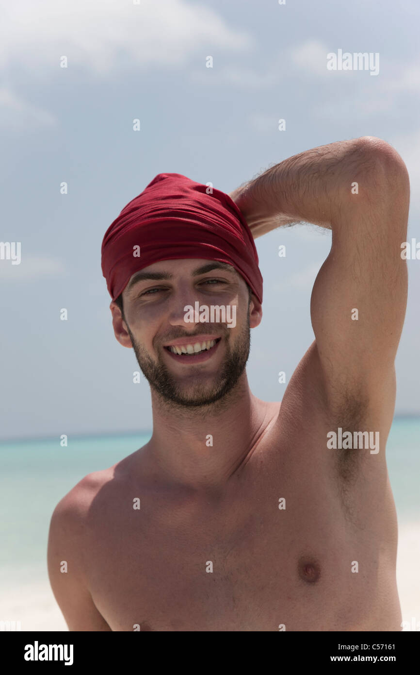 Man wearing turban on beach Stock Photo - Alamy