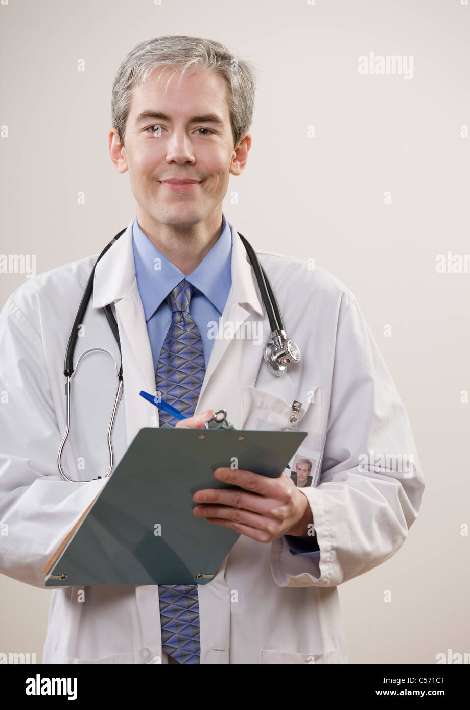 Standing authority looking up writing hi-res stock photography and ...