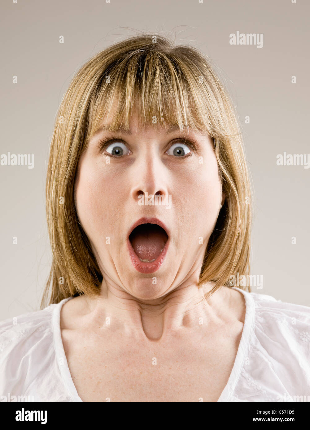 Surprised woman gasping Stock Photo - Alamy
