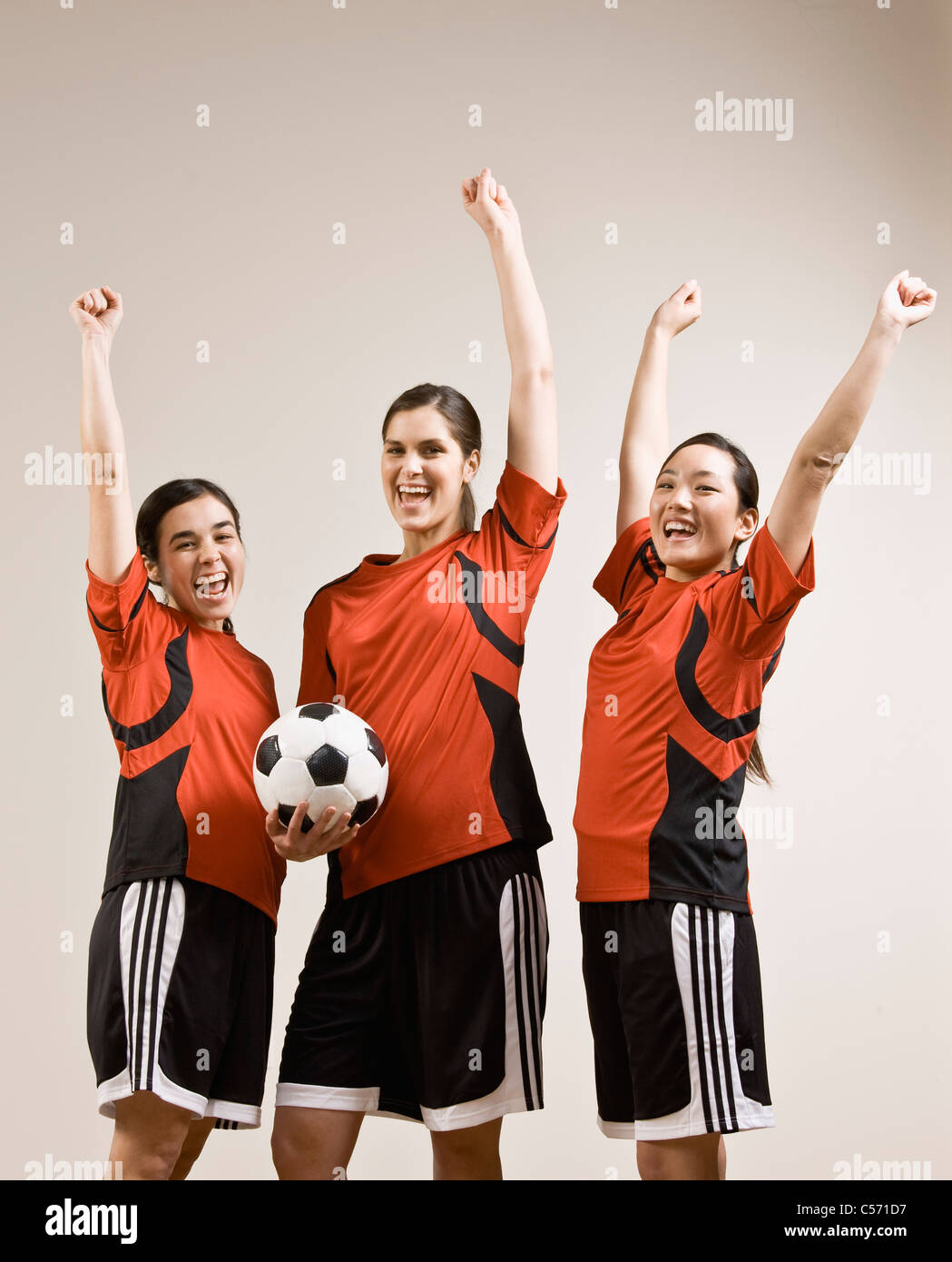 Soccer team cheering together Stock Photo - Alamy