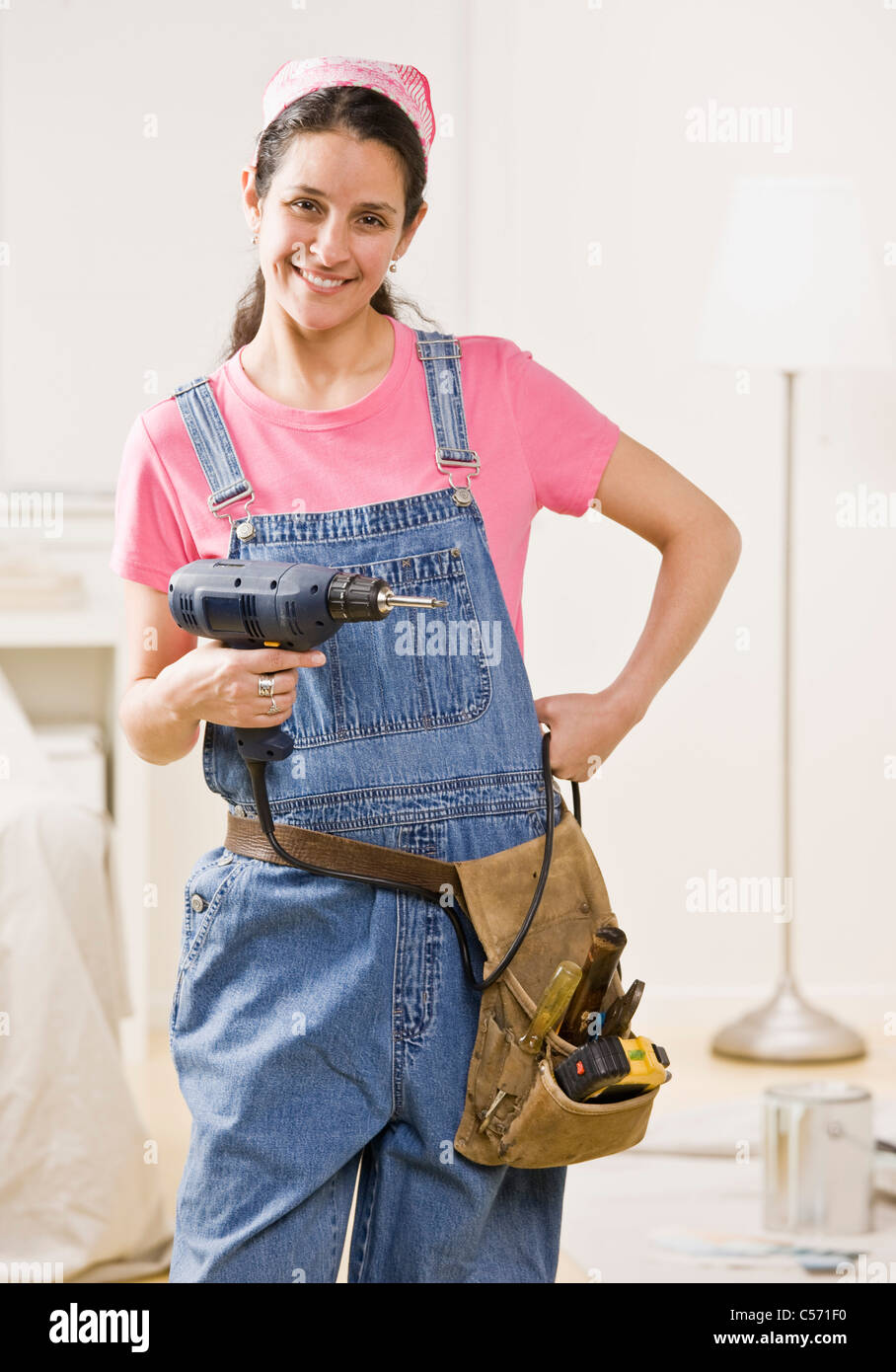 Woman using power tools at home Stock Photo - Alamy