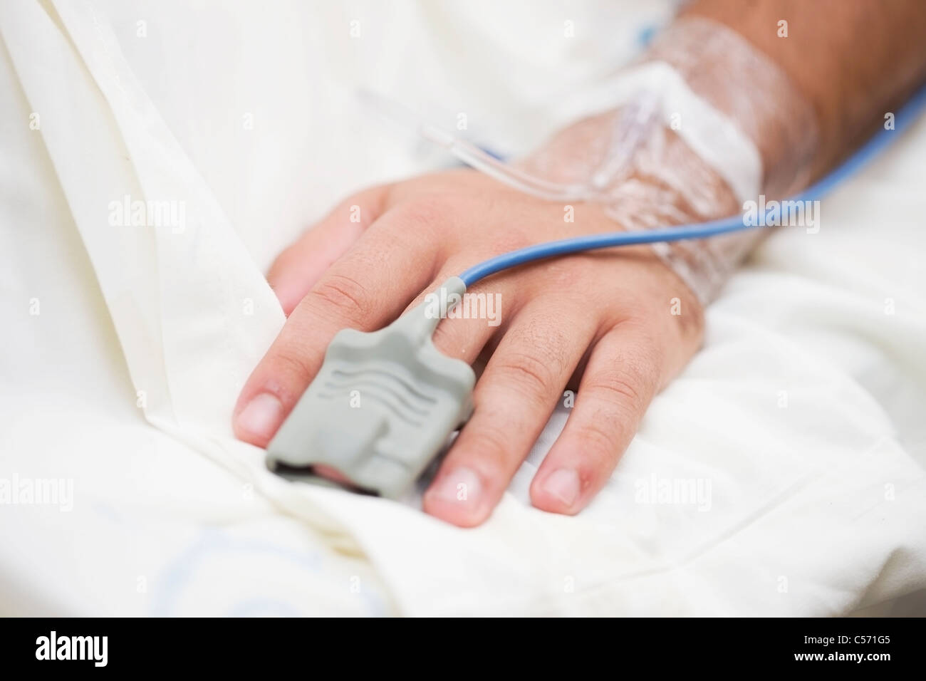 Finger heart monitor on hospital patient Stock Photo - Alamy