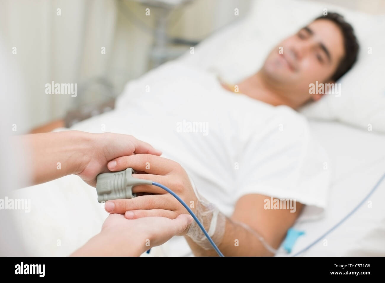 Person holding hospital patient’s hand Stock Photo - Alamy