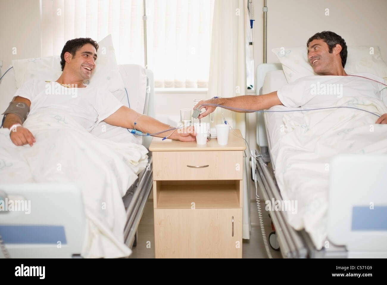 Patients talking in hospital beds Stock Photo - Alamy