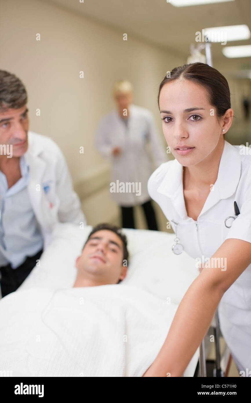 Nurse rushing patient down hallway Stock Photo - Alamy