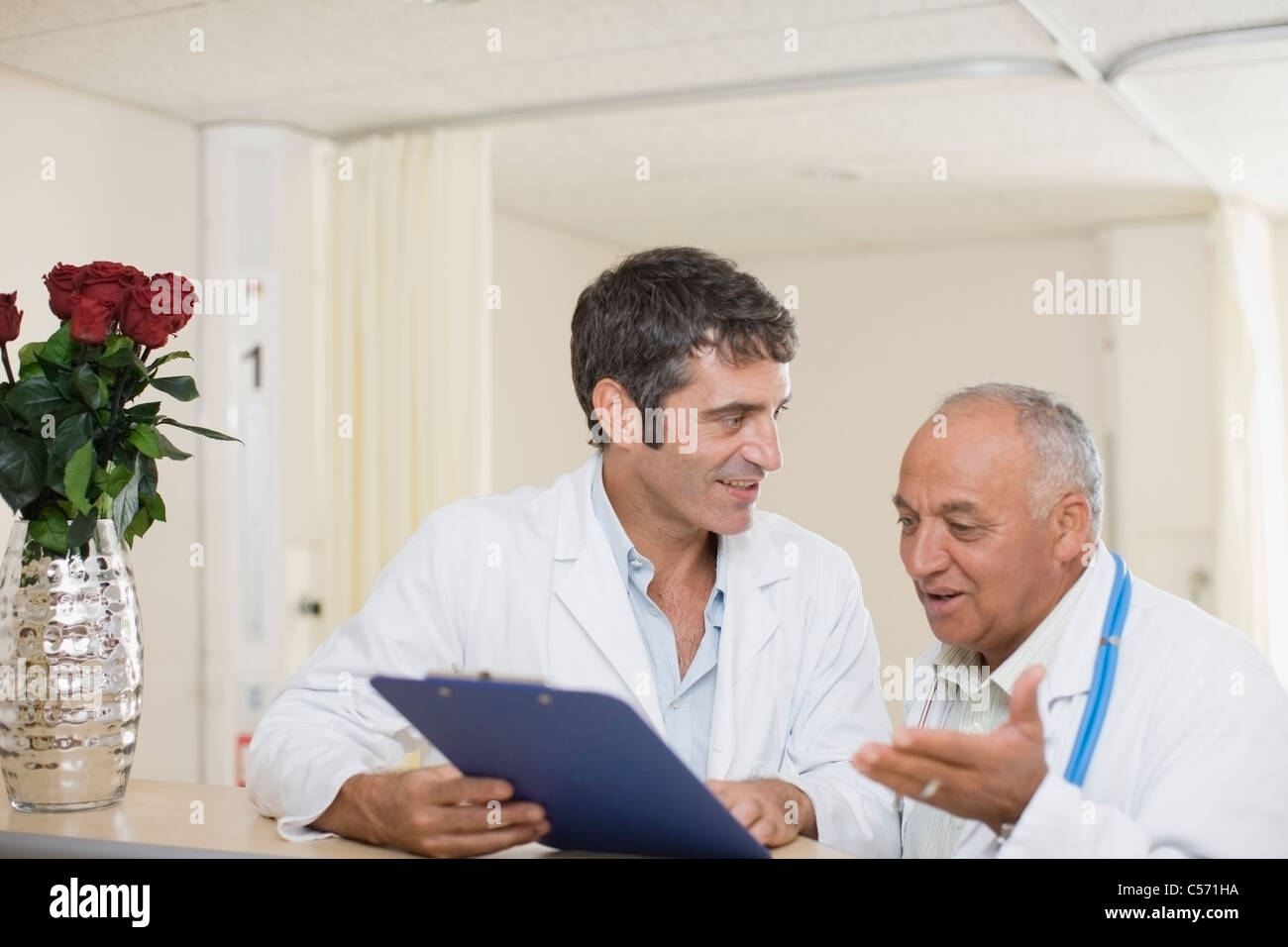 Doctors talking in hospital Stock Photo - Alamy
