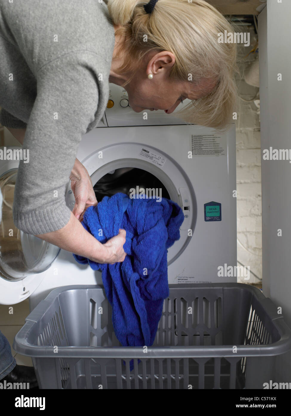 Woman Removing Clothes High Resolution Stock Photography and Images - Alamy