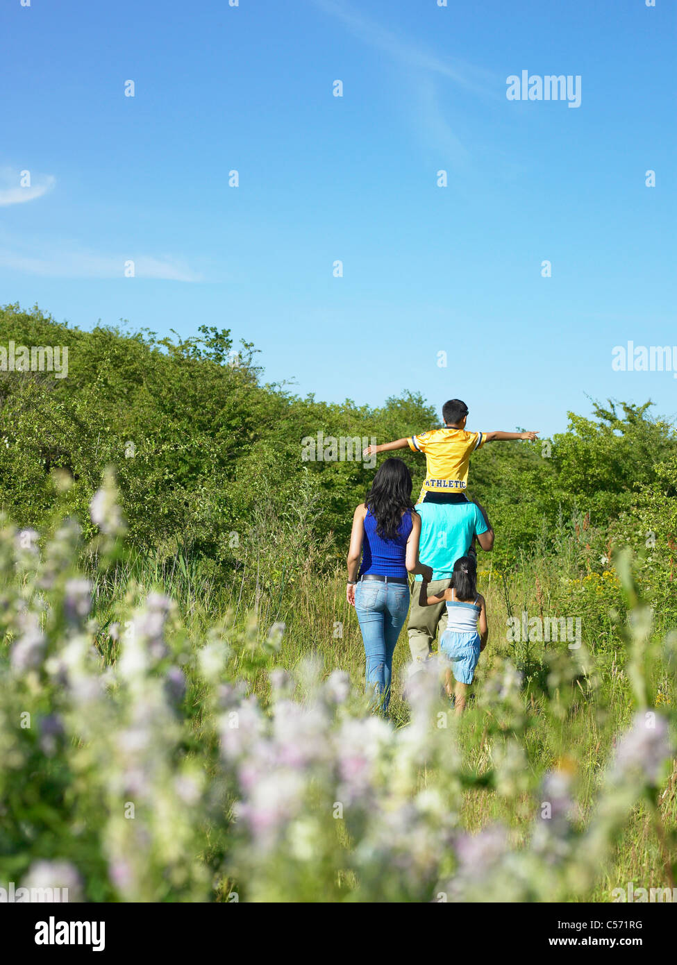 Boy parents plant flowers in hi-res stock photography and images - Alamy