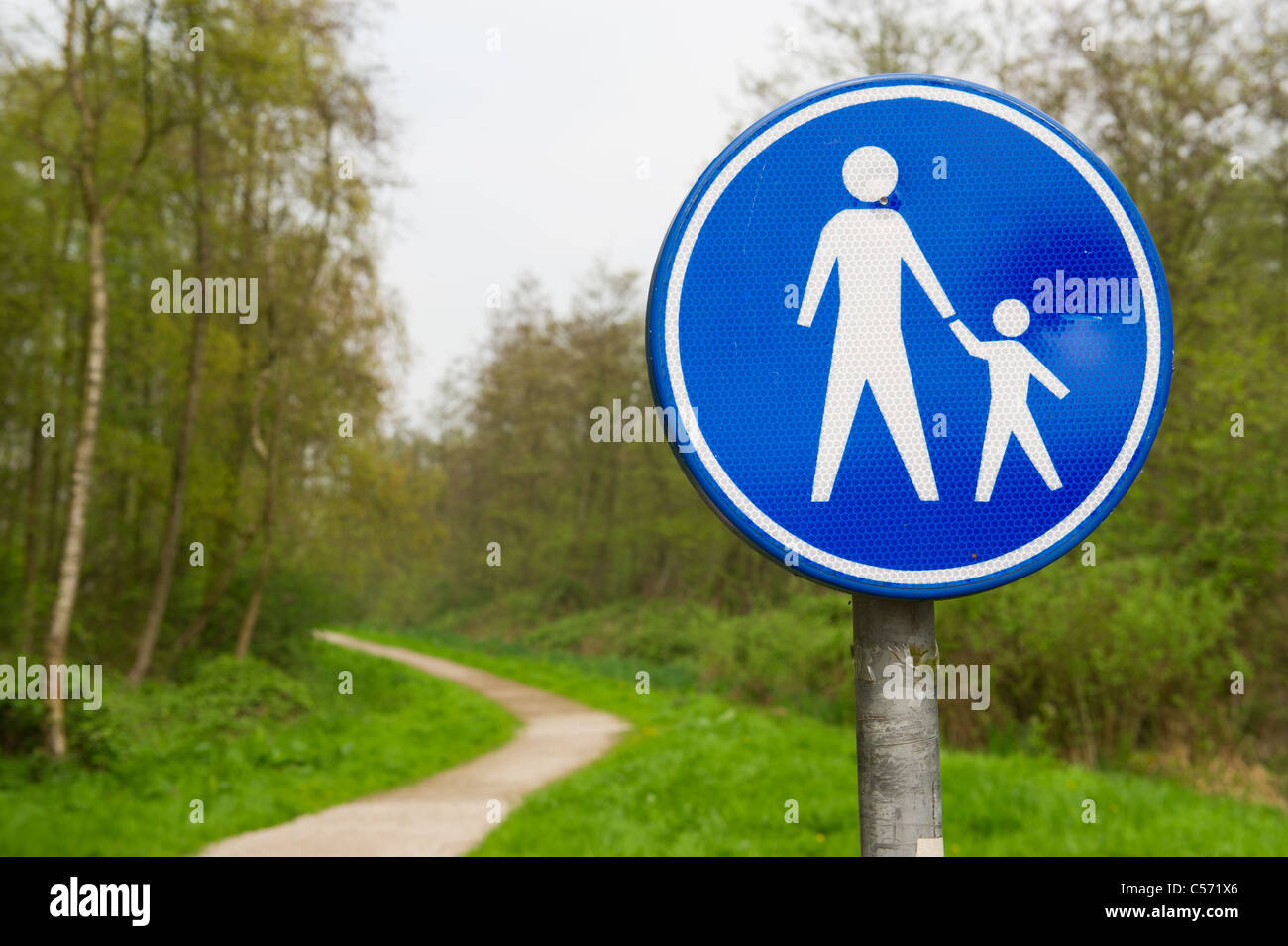 Sign for foot path in nature environment Stock Photo - Alamy