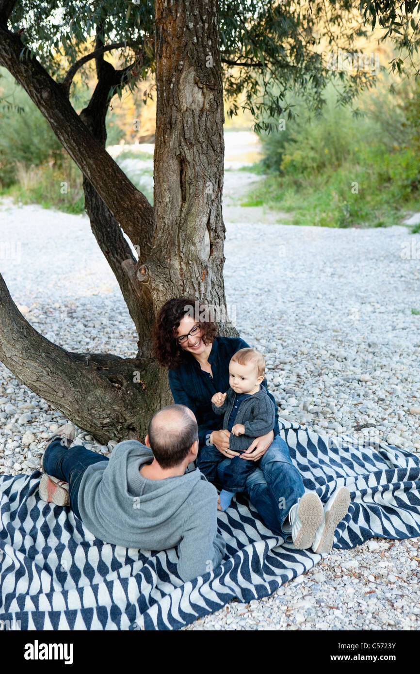 Two men sitting under tree hi-res stock photography and images - Alamy