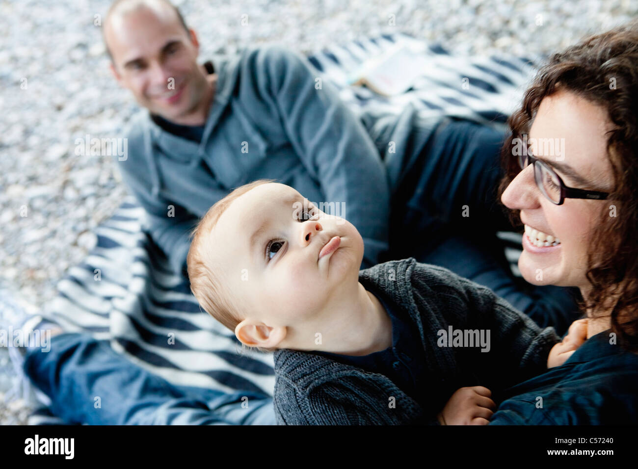 Family relaxing outdoors together Stock Photo - Alamy