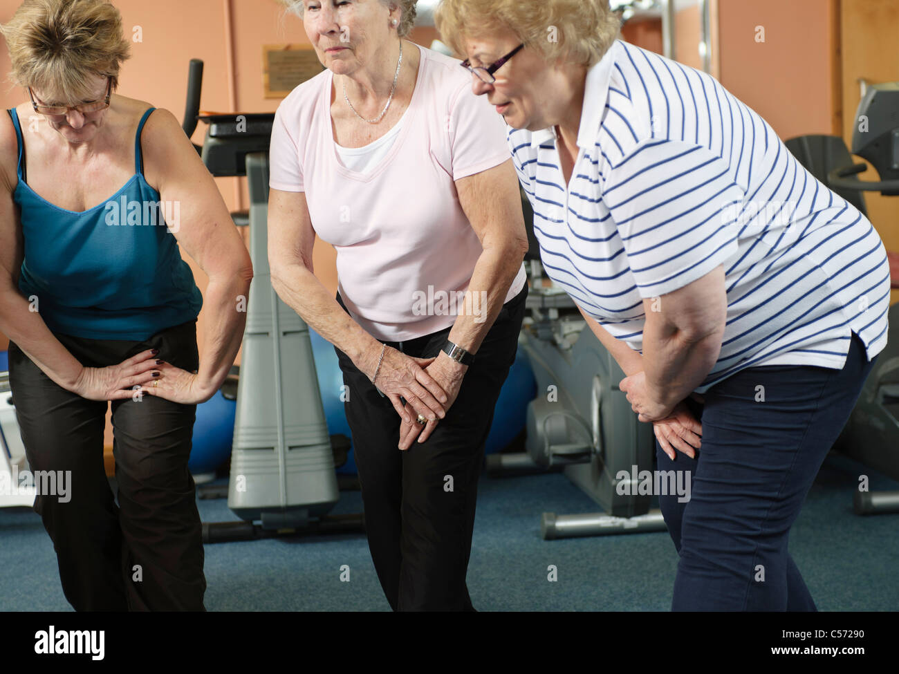 Older women stretching in gym hi-res stock photography and images - Alamy