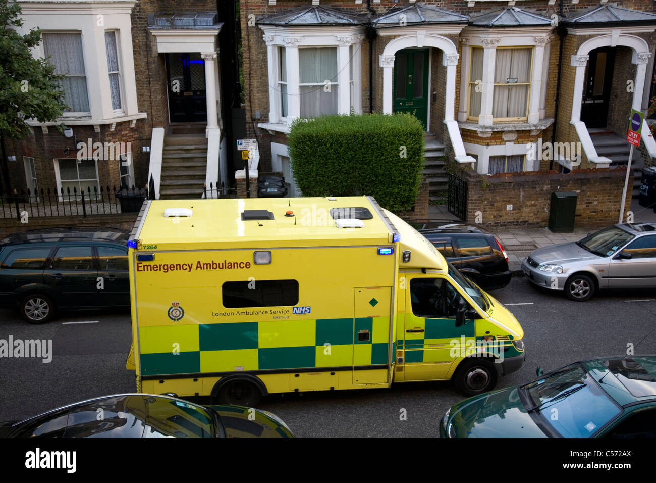 Emergency ambulance in residential street Stock Photo - Alamy