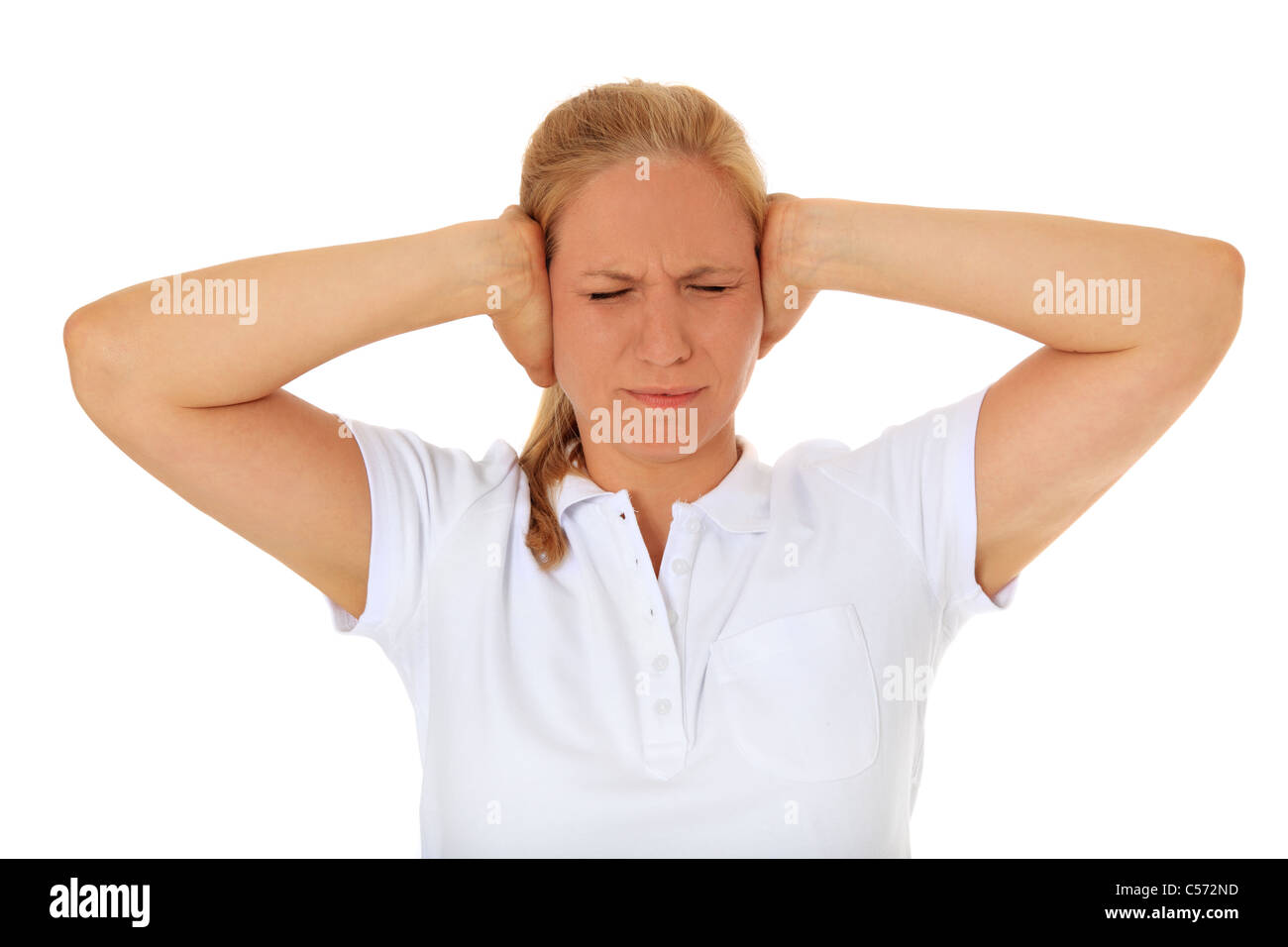 Attractive woman keeps her ears shut. All on white background Stock ...
