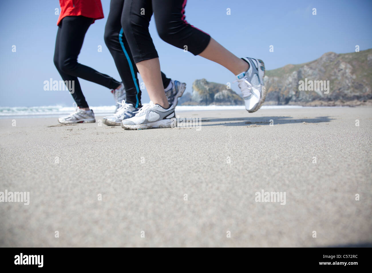 Legs running on beach Stock Photo - Alamy