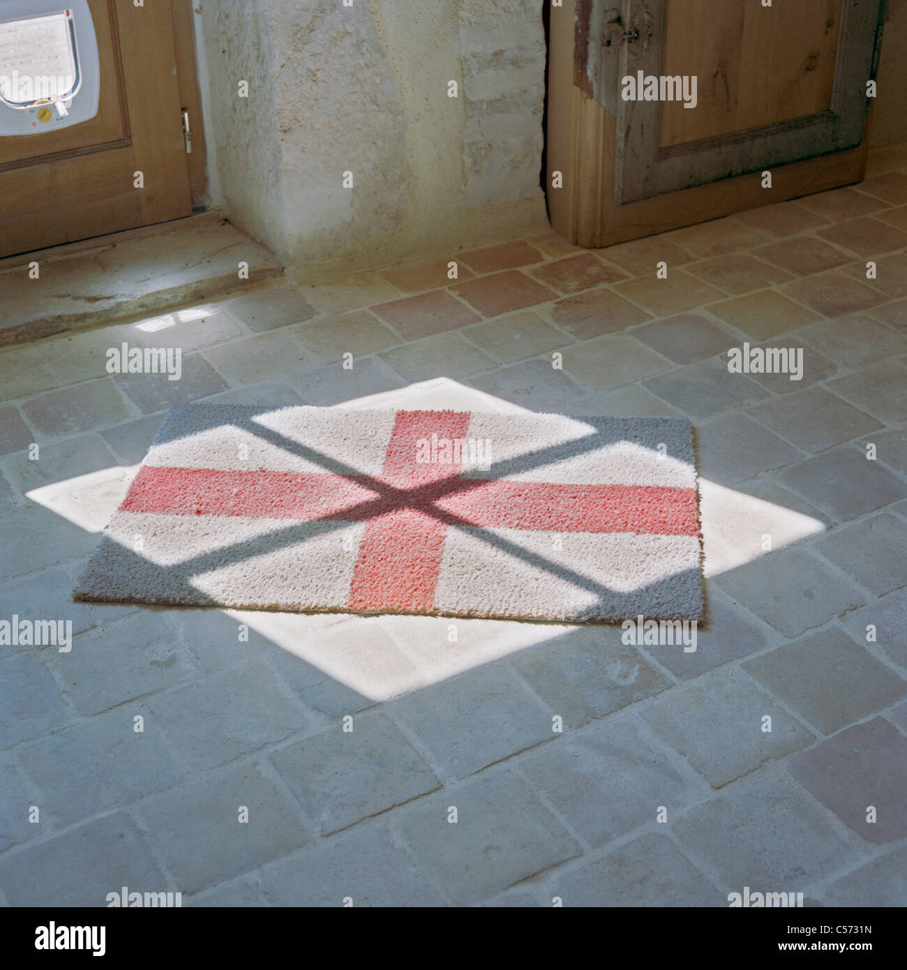 Mat lit with sunlight from window Stock Photo - Alamy