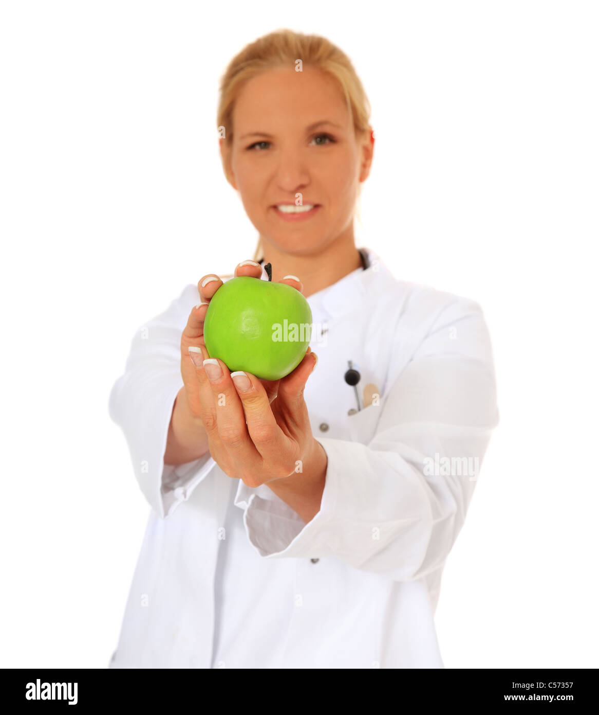 Doctor holding green apple. All on white background Stock Photo - Alamy