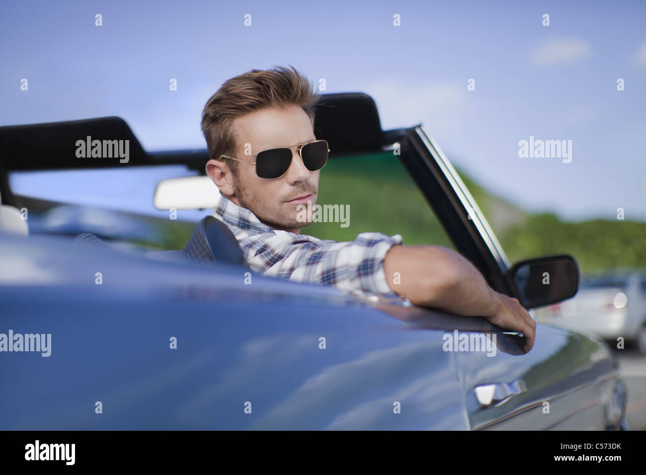 Cool guy driving convertible car hi-res stock photography and images ...