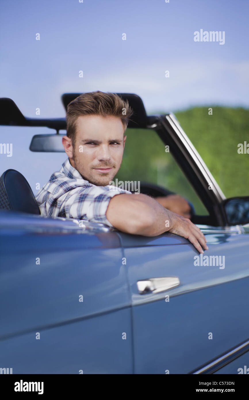 Cool guy driving convertible car hi-res stock photography and images ...