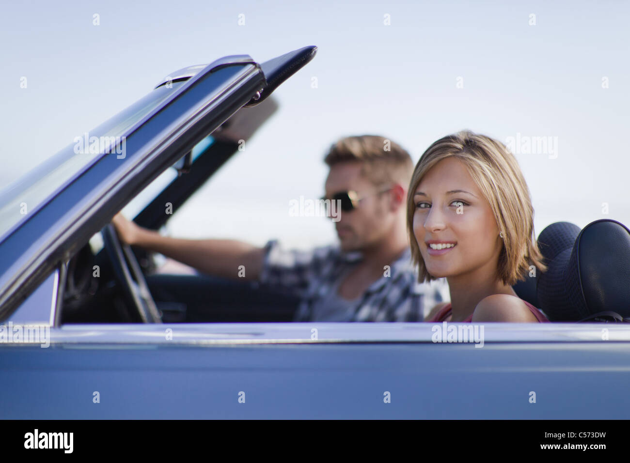 Woman riding in convertible Stock Photo - Alamy