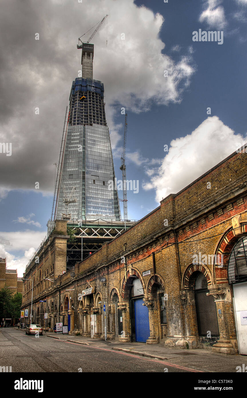 The Shard skyscraper and arches under London Bridge Station in ...