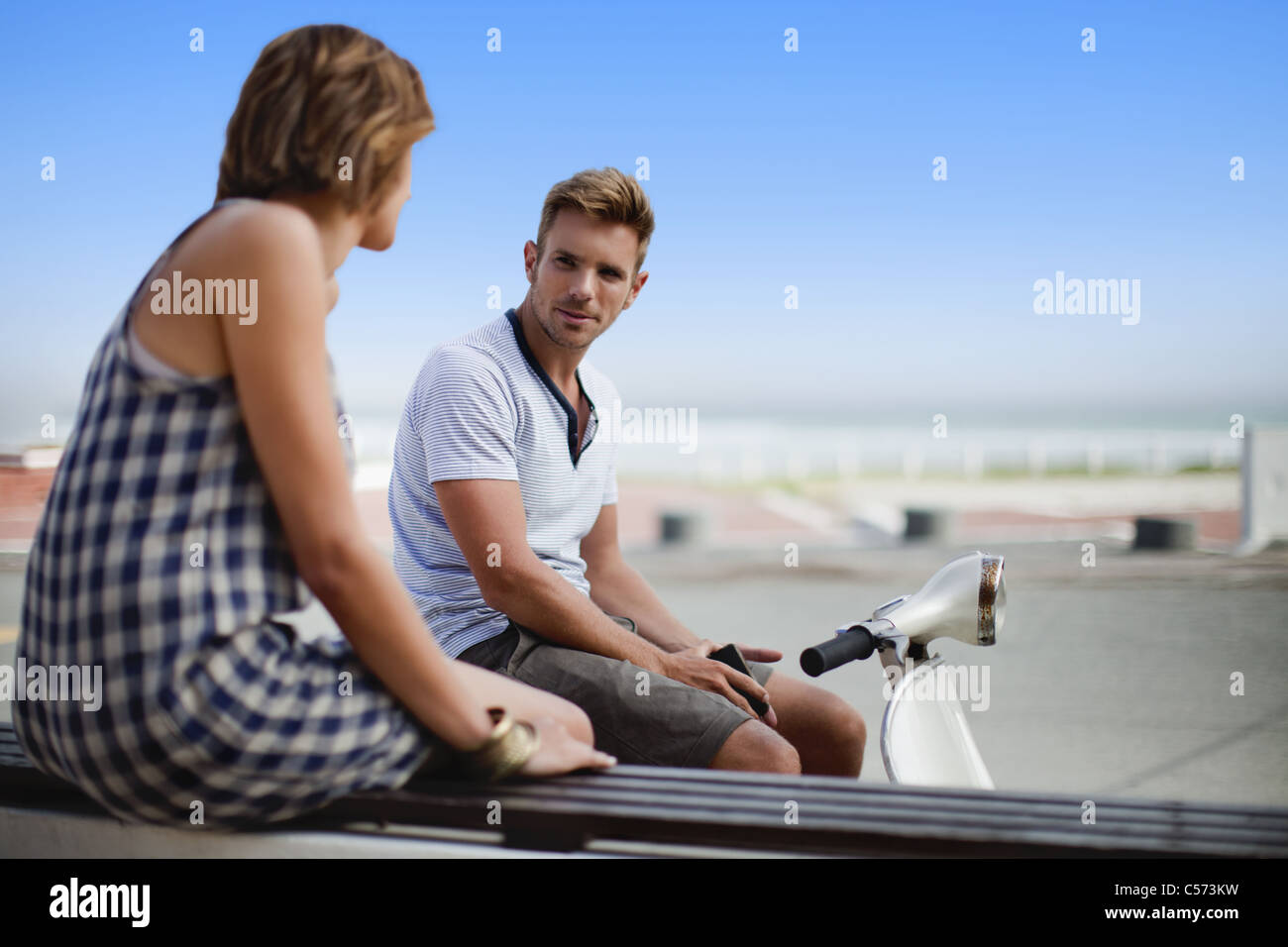 Couple talking outdoors Stock Photo - Alamy