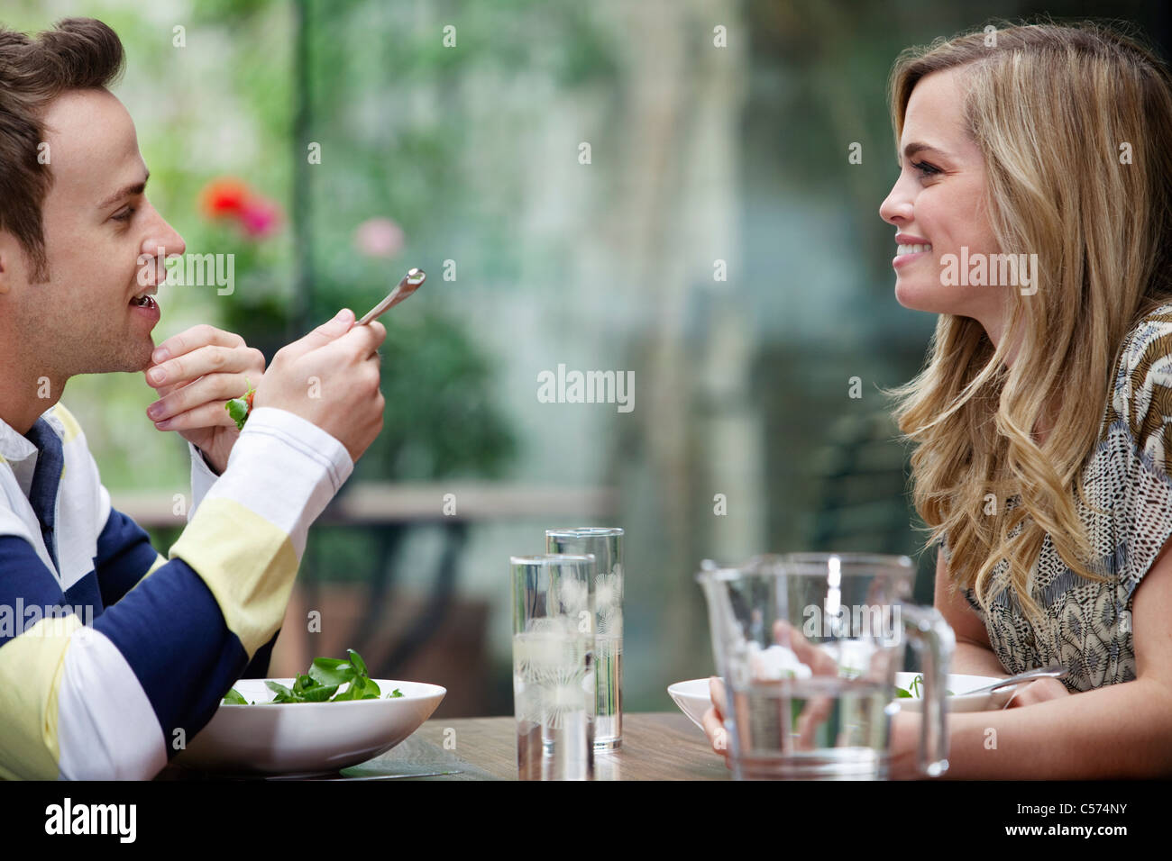 Couple eating together at home Stock Photo - Alamy