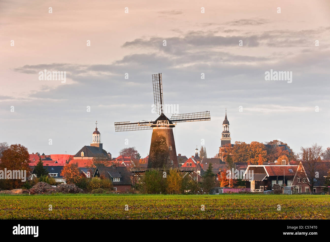 The Netherlands, Ootmarsum. View on village with windmill and churches ...