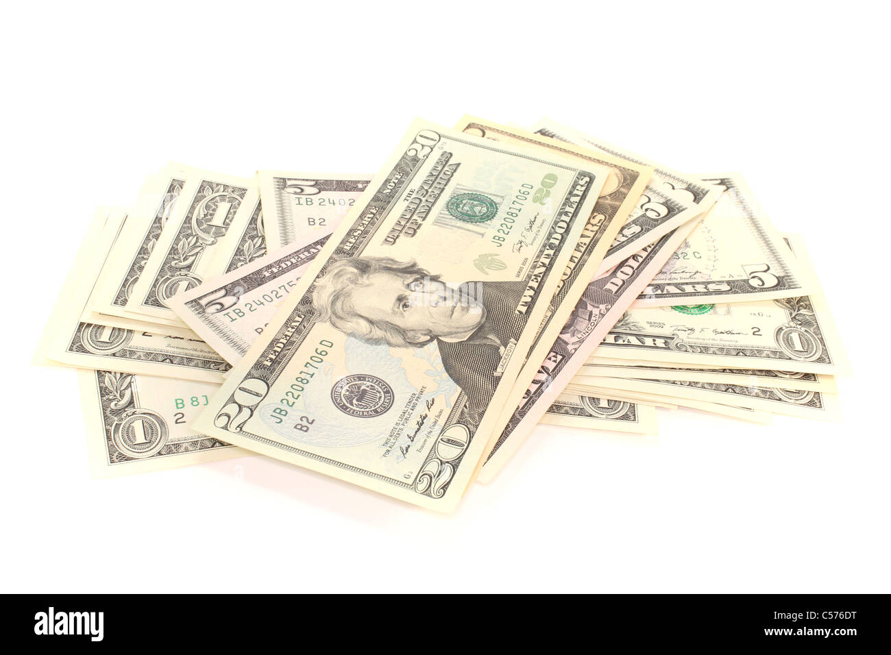 a stack of many colorful dollar bills on white background Stock Photo ...