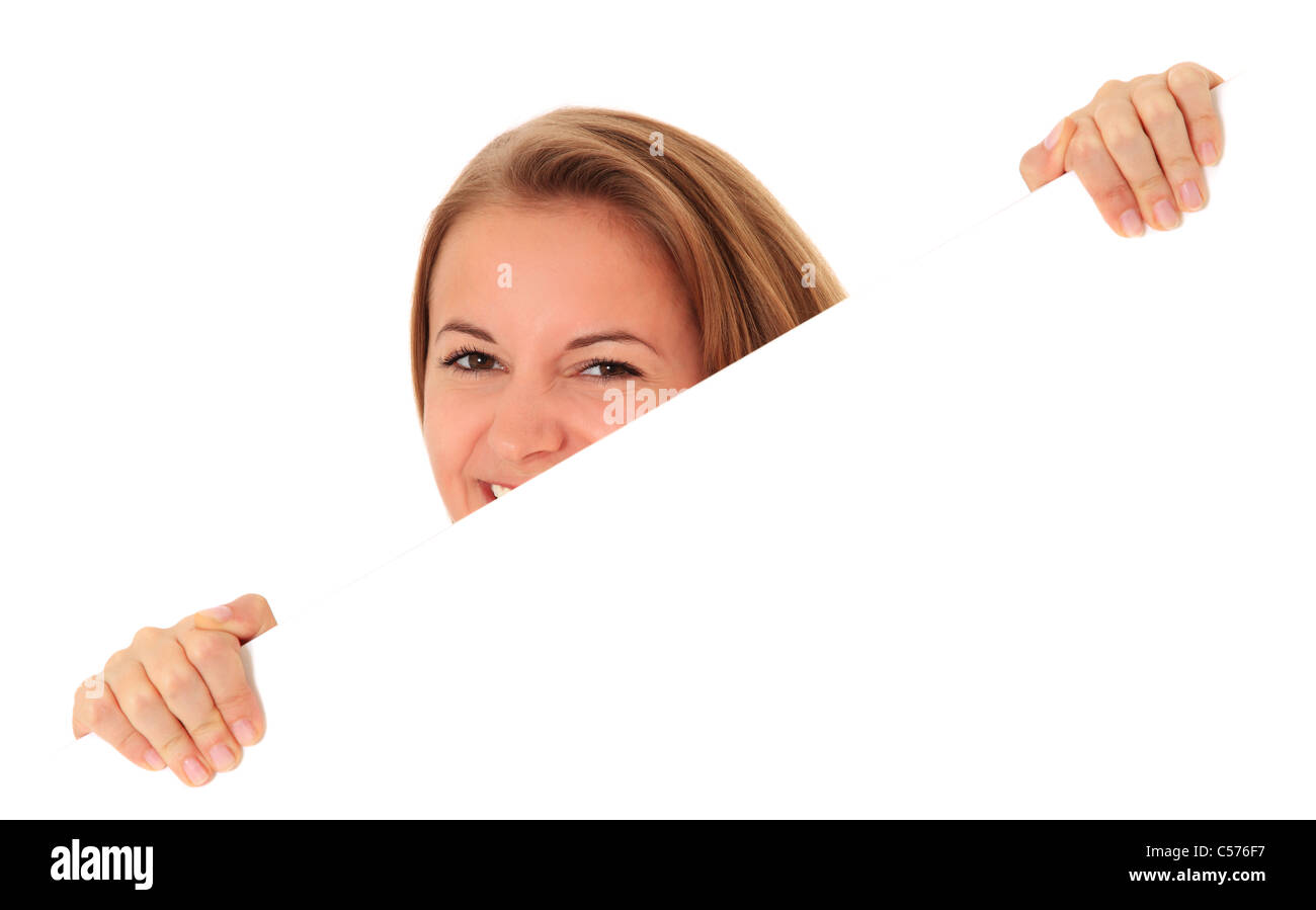 Attractive young woman behind white wall. All on white background Stock ...