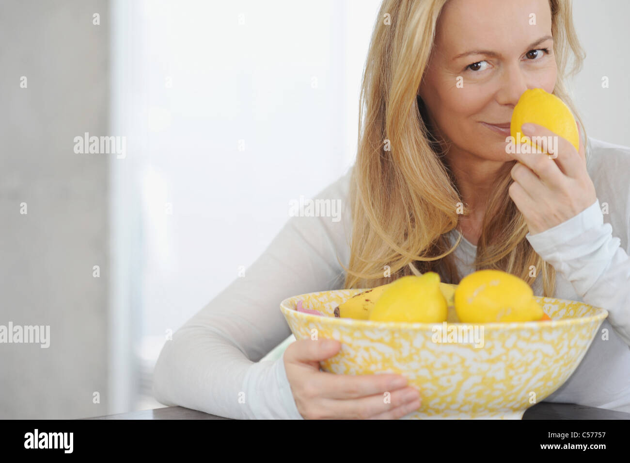 Woman lemon mature looking at camera hi-res stock photography and ...
