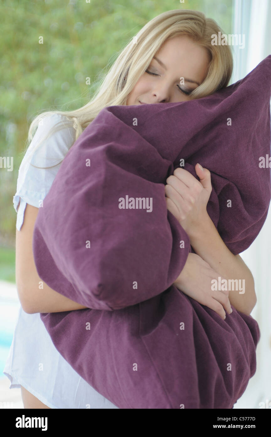 Young Woman Hugging Pillow High Resolution Stock Photography and Images ...