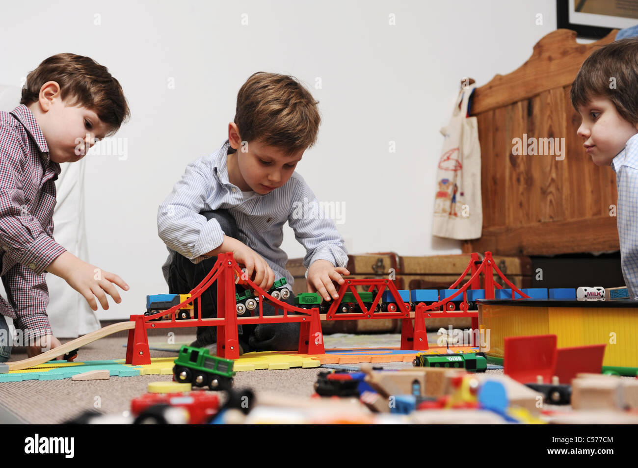 Children playing with toys together Stock Photo - Alamy