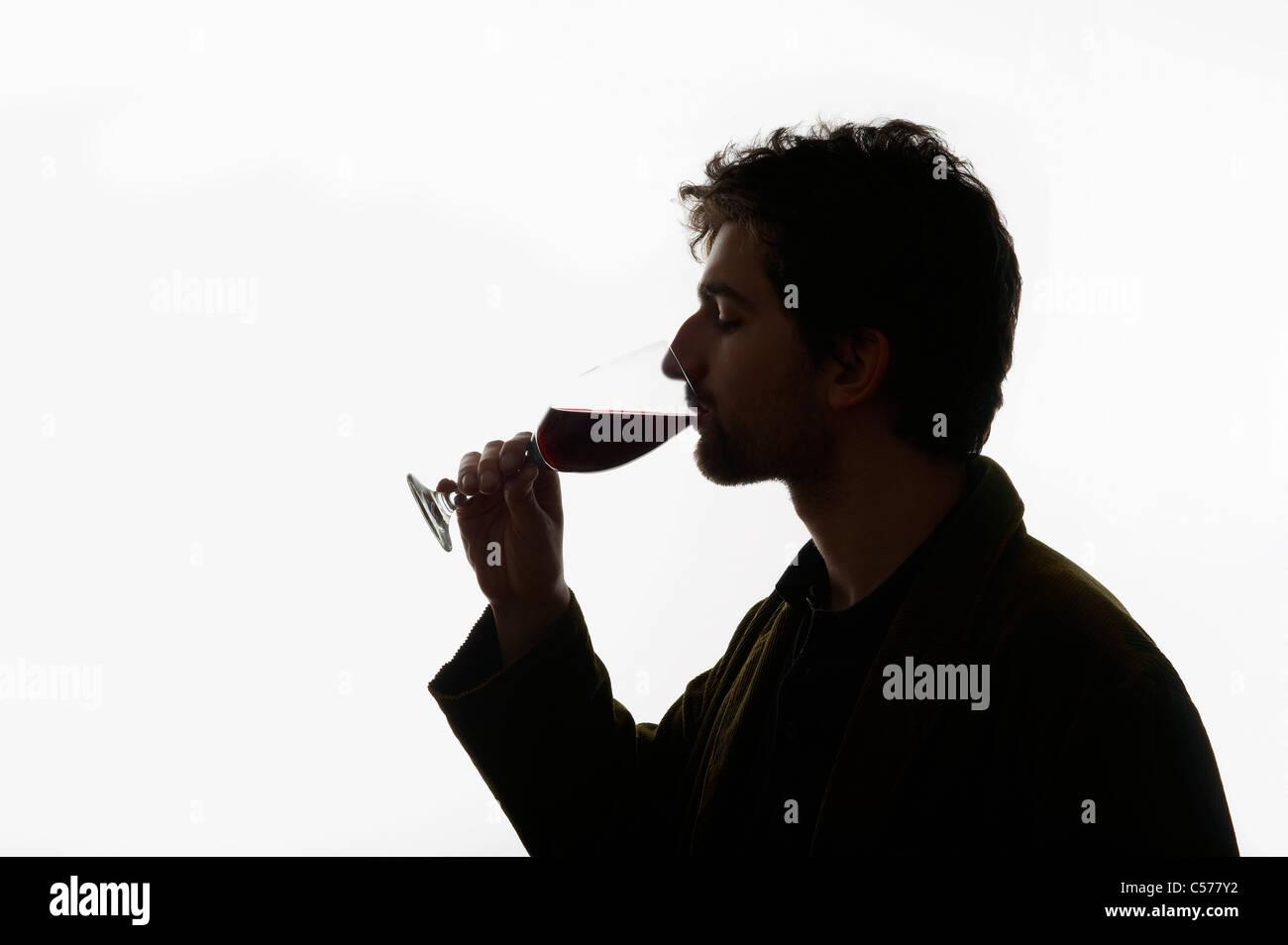 Man drinking glass of wine Stock Photo - Alamy
