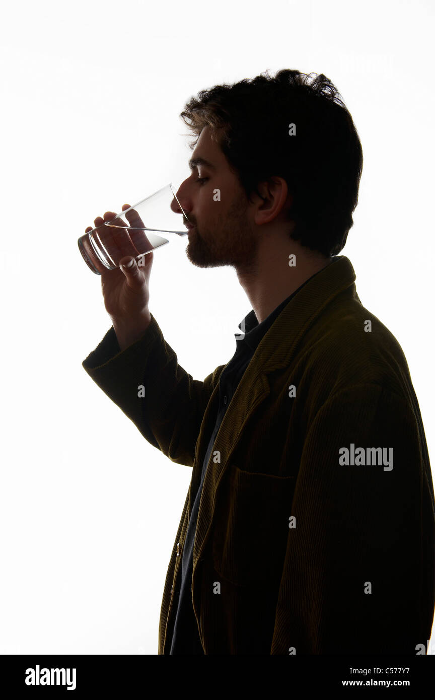 Man drinking glass of water Stock Photo - Alamy