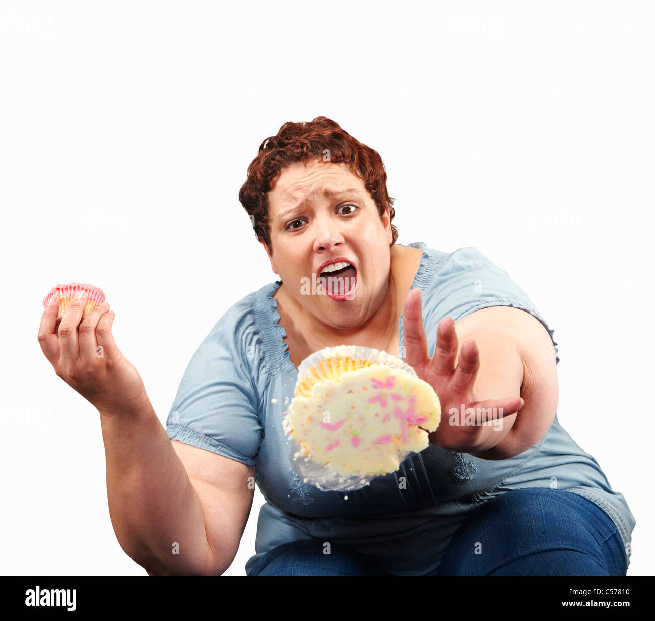 Large woman dropping cupcake Stock Photo - Alamy