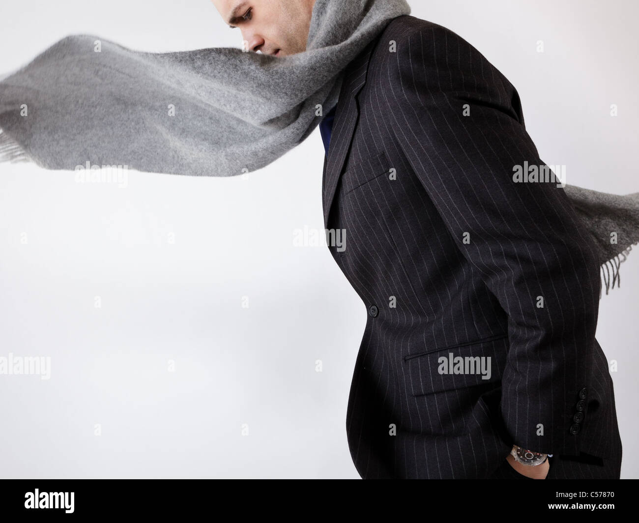 Man walking suit windy hi-res stock photography and images - Alamy
