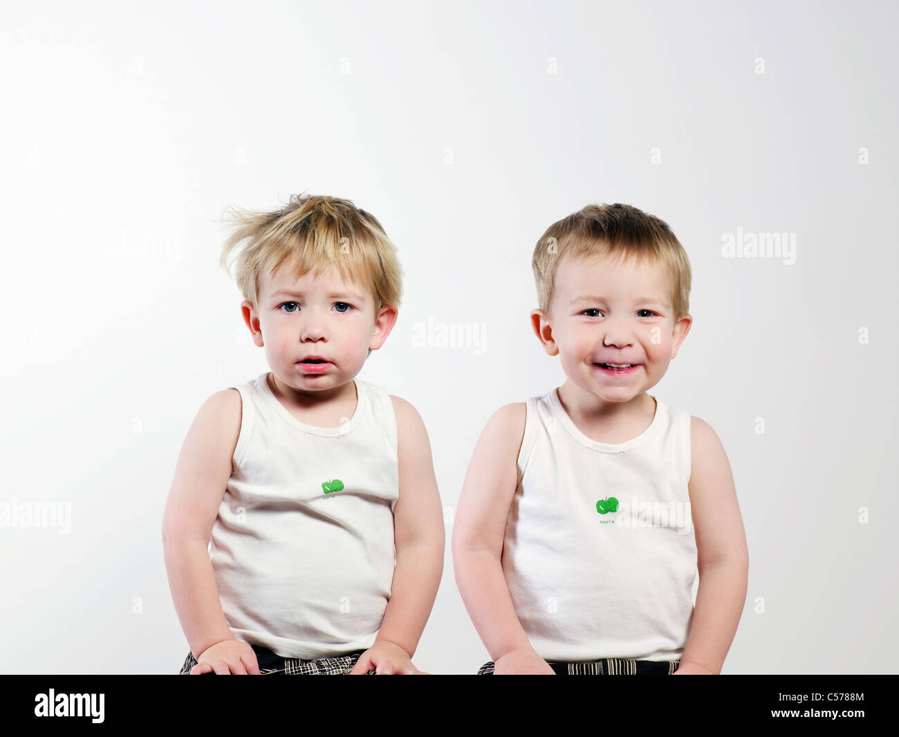Twin boys sitting together Stock Photo - Alamy Twin boys sitting together Stock Photo - Alamy