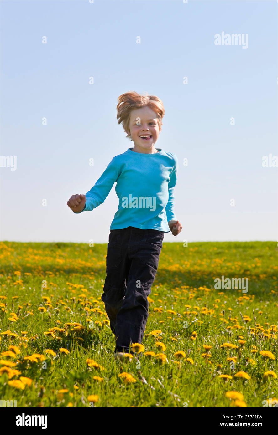 Children running in field flowers hi-res stock photography and images ...