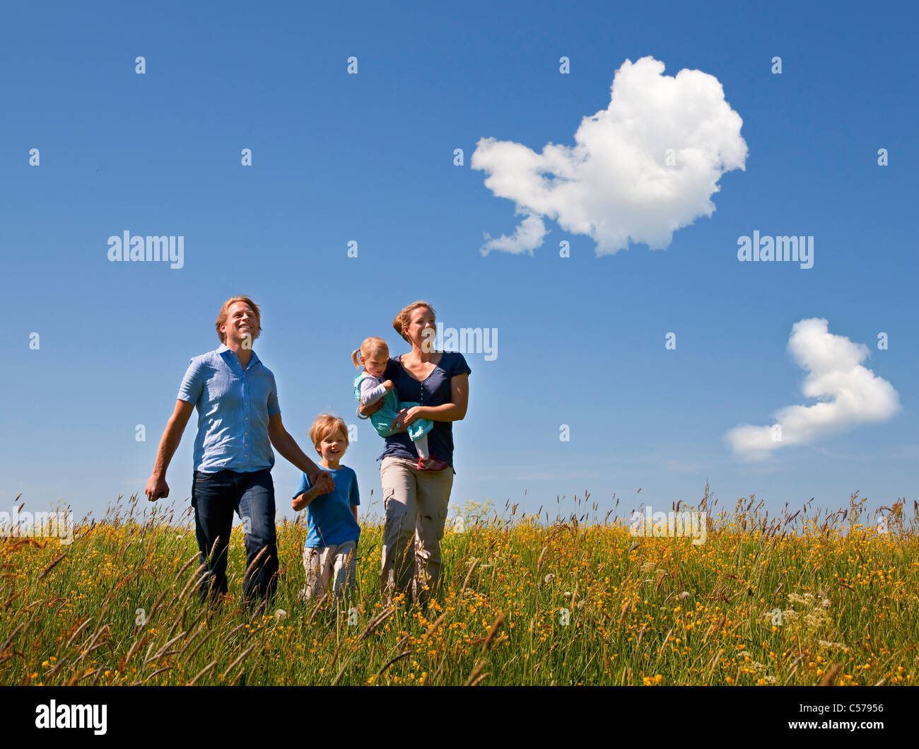 Boy parents plant flowers in hi-res stock photography and images - Alamy