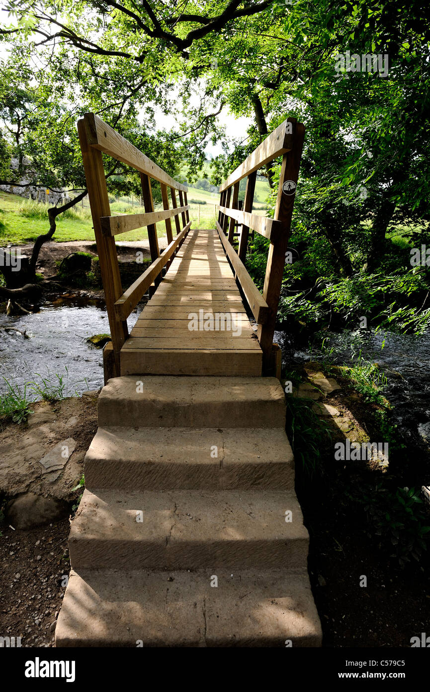 wooden footbridge over the river dove dovedale derbyshire england uk ...
