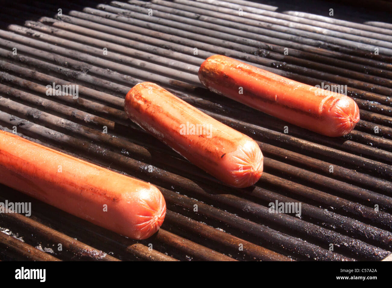Hot dogs on a bbq Stock Photo - Alamy