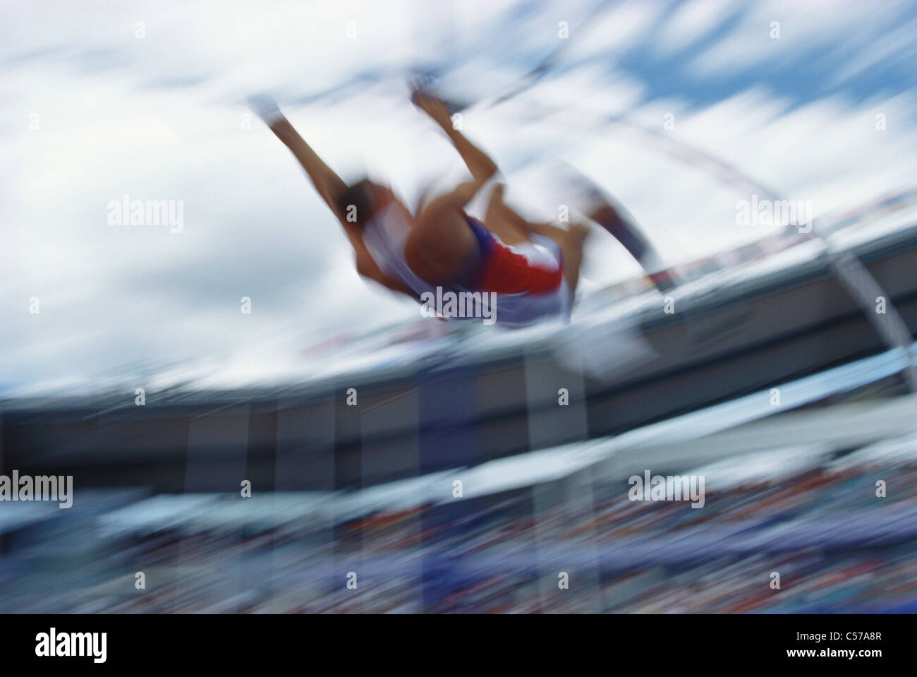 Pole vaulter flies over the bar Stock Photo - Alamy